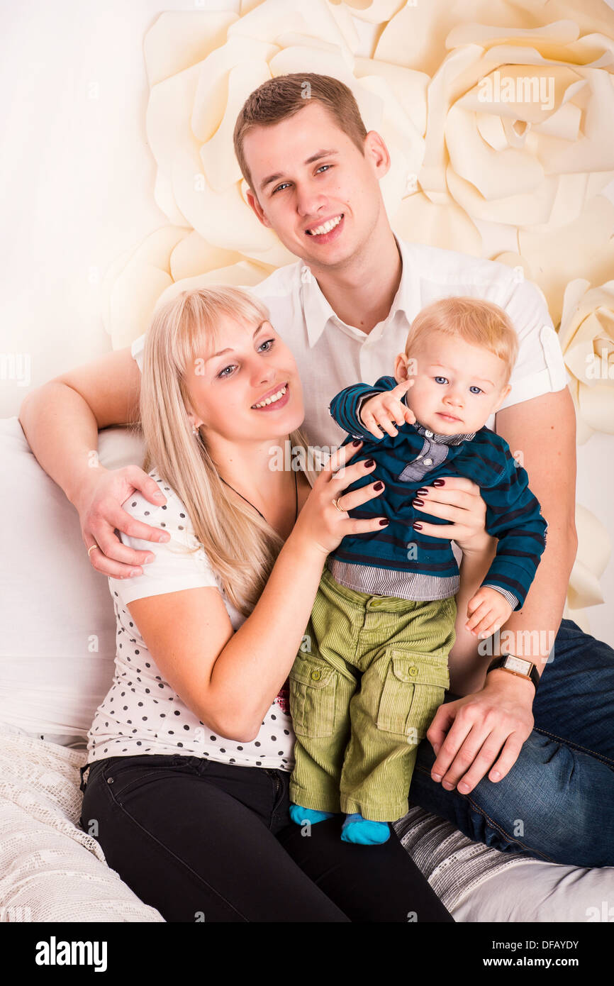 Portrait of a happy family: mother, father and a baby Stock Photo - Alamy