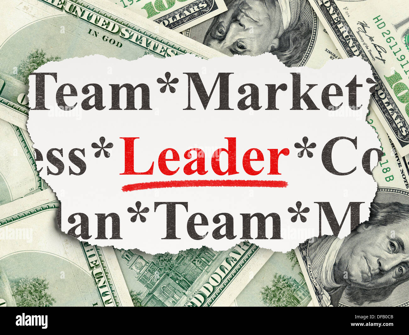 Torn newspaper with words Leader on money background Stock Photo - Alamy