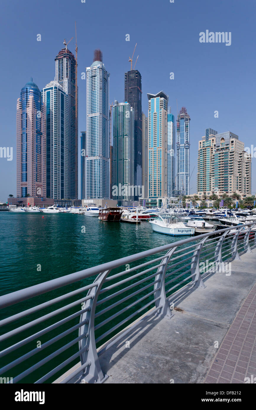 The Dubai Marina with high rise buildings and boats in Dubai, UAE ...