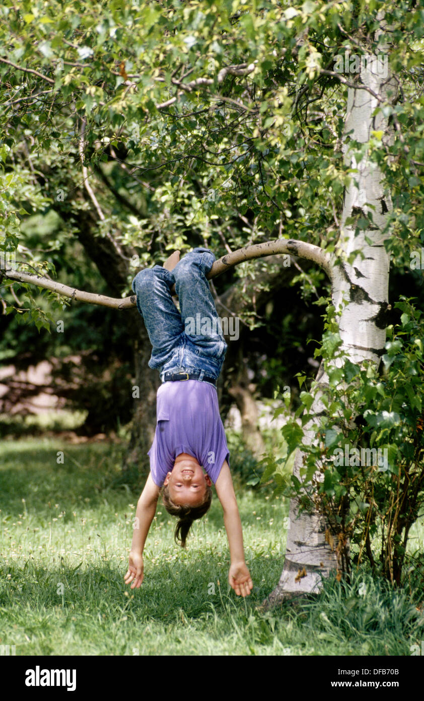 Girls Hanging Upside Down Tree