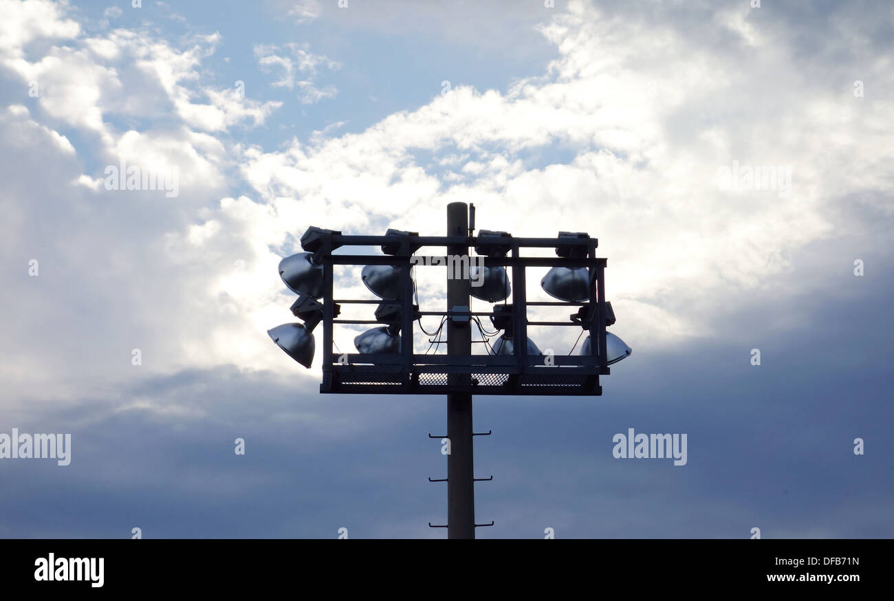 Stadium light post and cloudy sky Stock Photo - Alamy