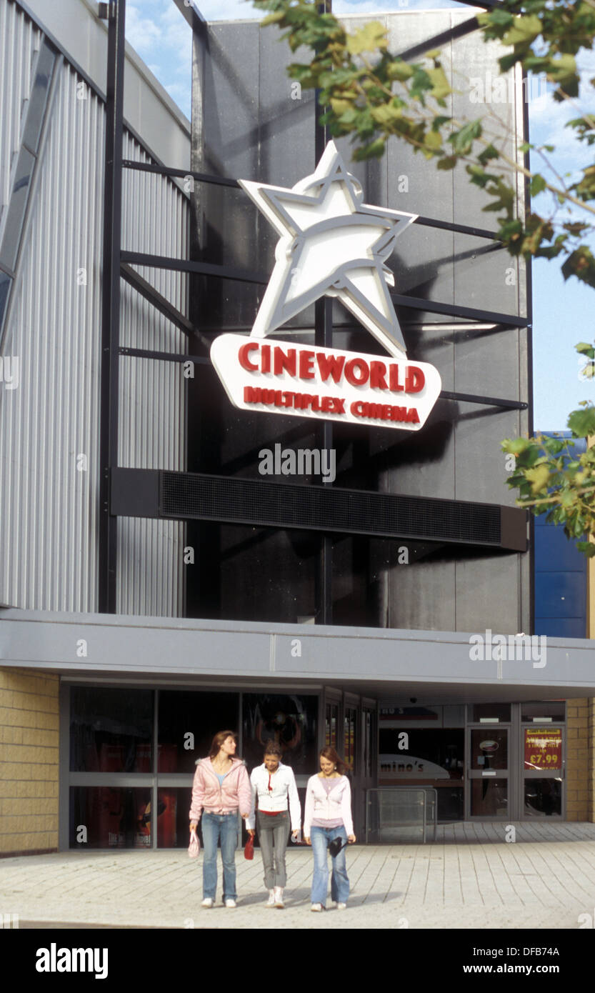 three young girls coming out of cinema Stock Photo - Alamy