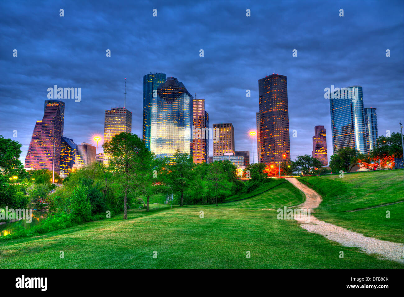 Houston Texas modern skyline at sunset twilight from park lawn Stock ...