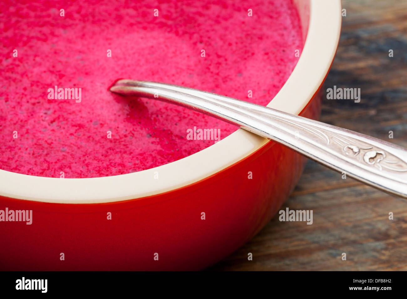 red beet cream soup in a stoneware bowl on wood surface Stock Photo - Alamy