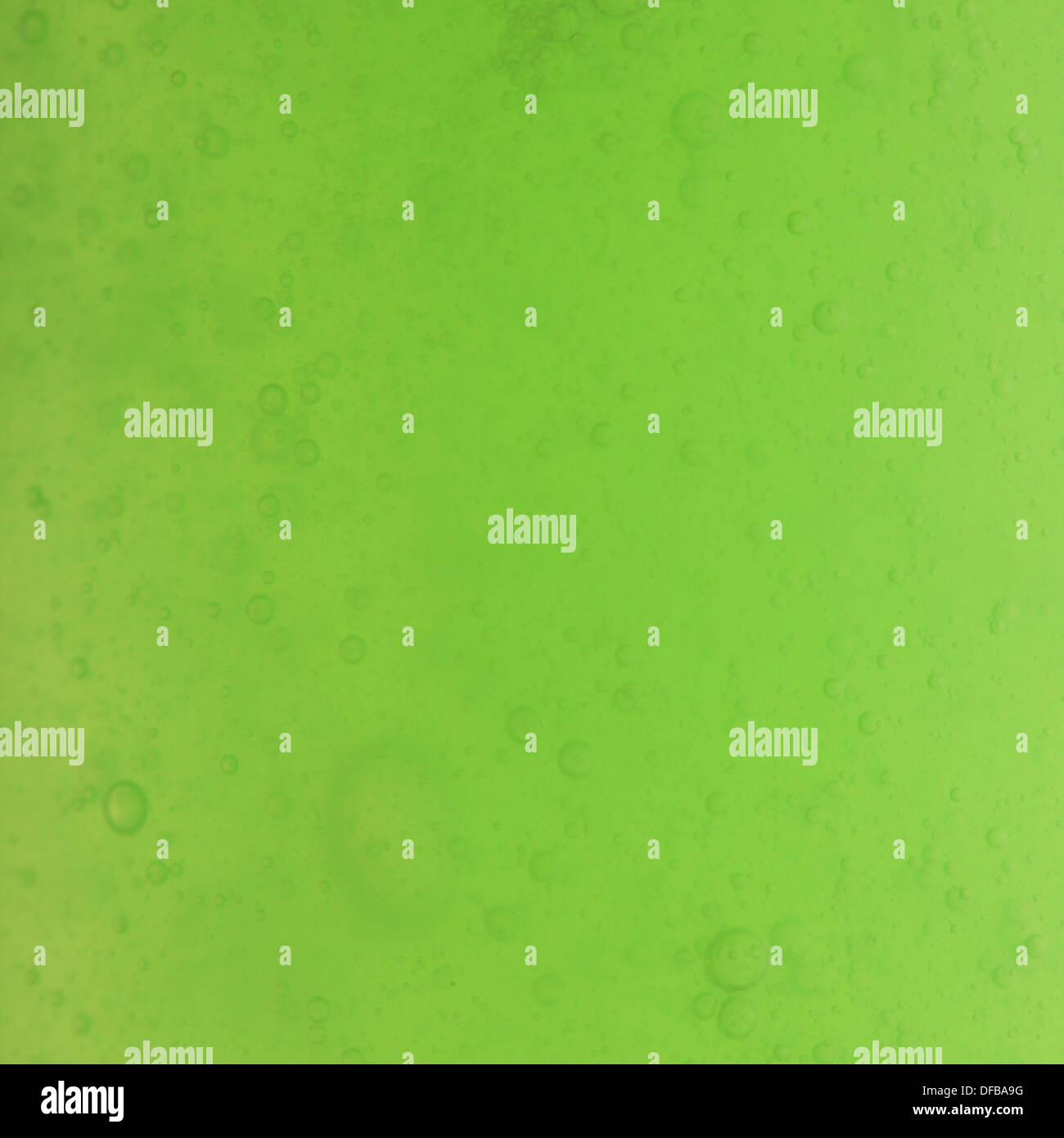 Green abstract blurred liquid background with soap bubbles. Square ...