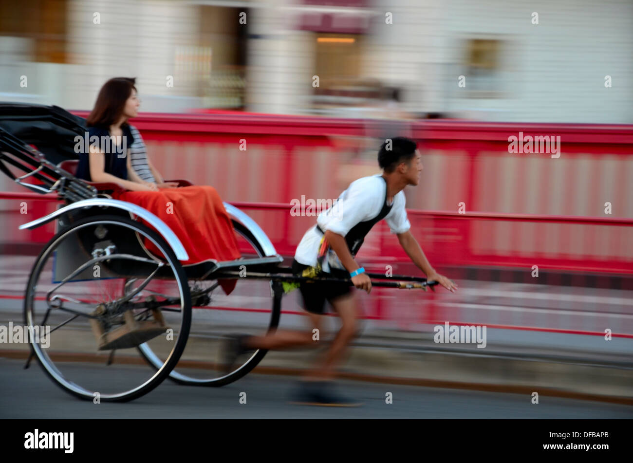 Japanese tourists ride rickshaw in Tokyo, Japan Stock Photo - Alamy