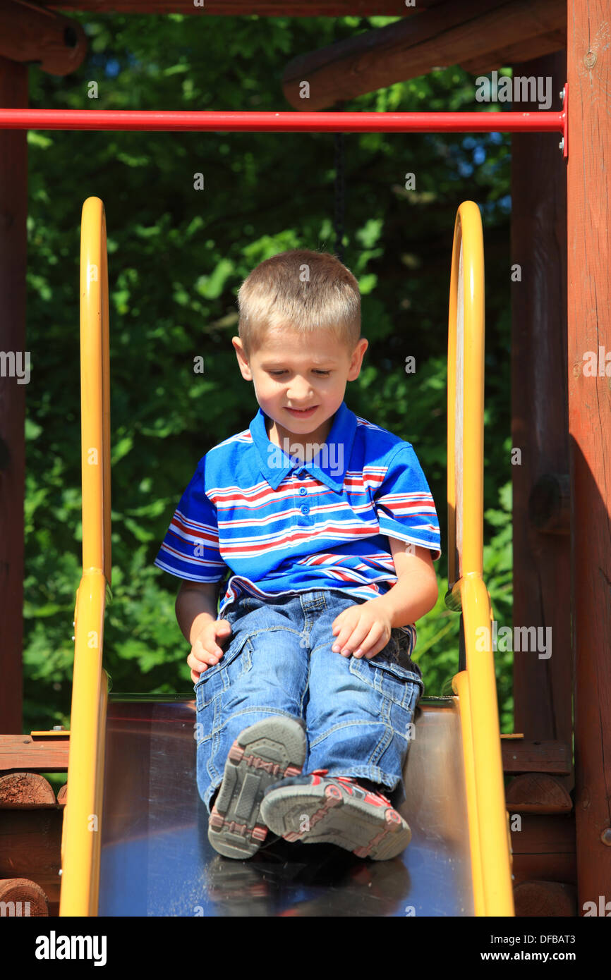 child in playground kid in action boy play on leisure equipment ready ...
