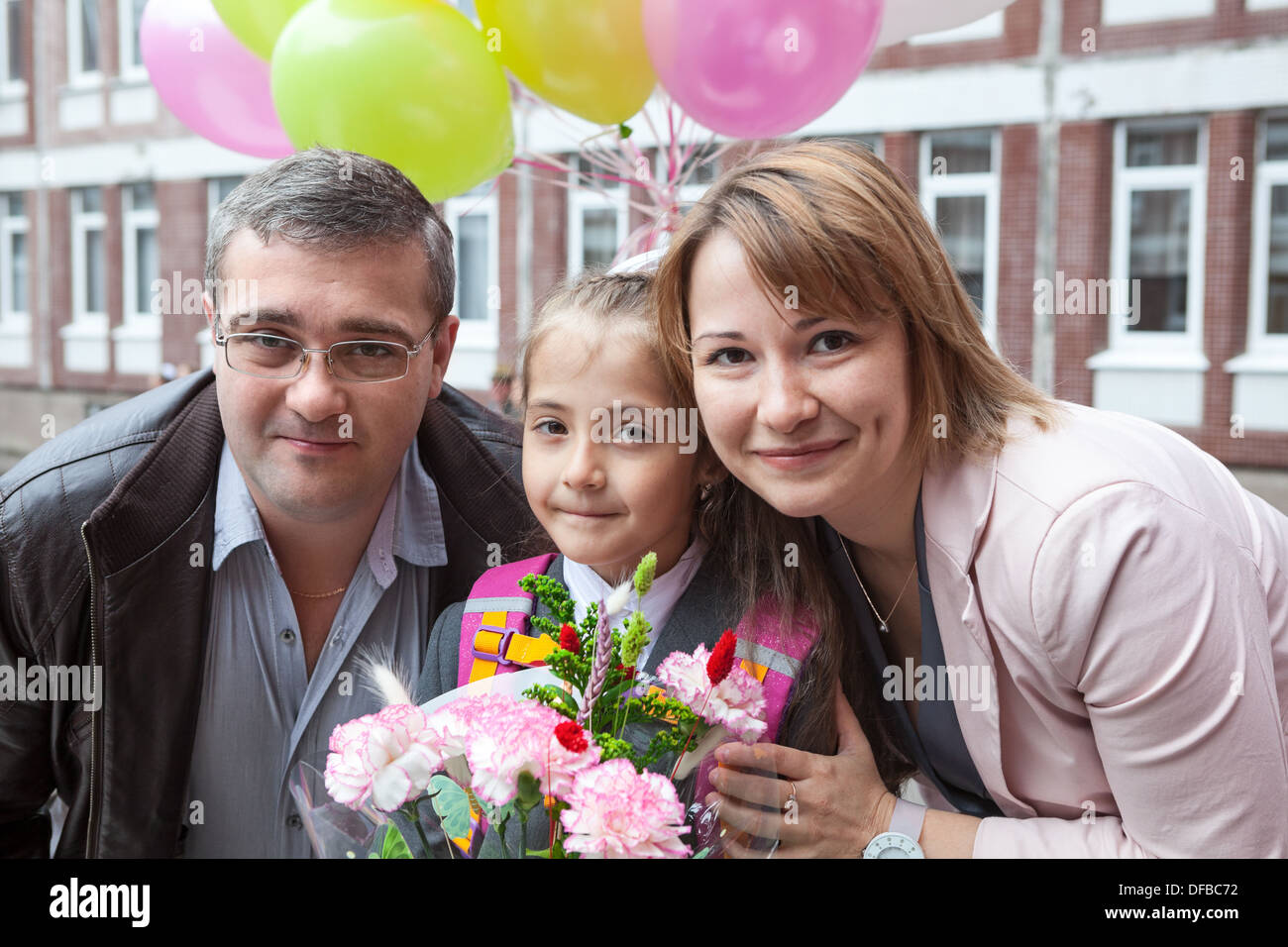 Happy Russian parents portrait with first class schoolgirl before ...