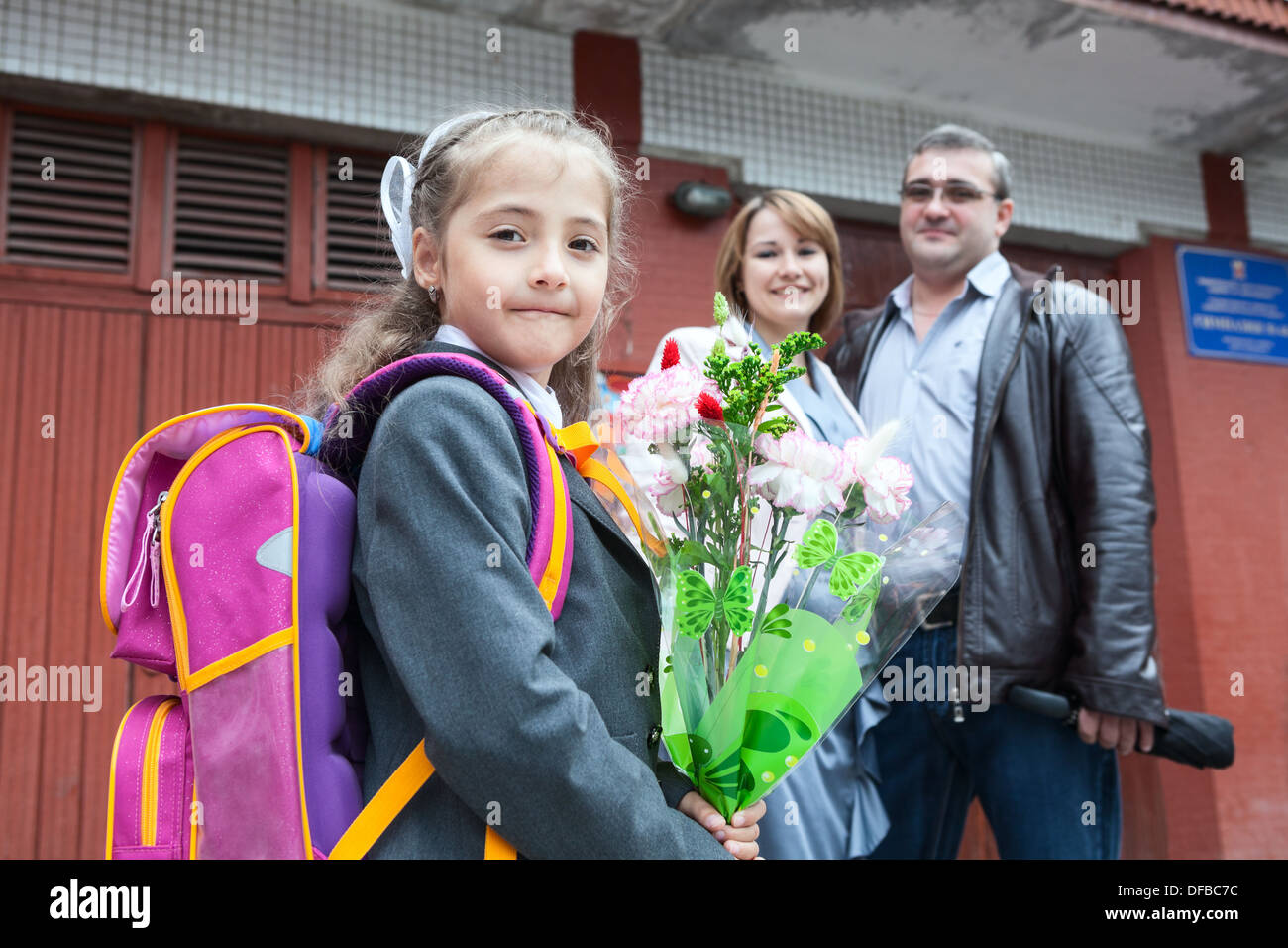 Happy parents with daughter going back to school. Russia. Russian ...
