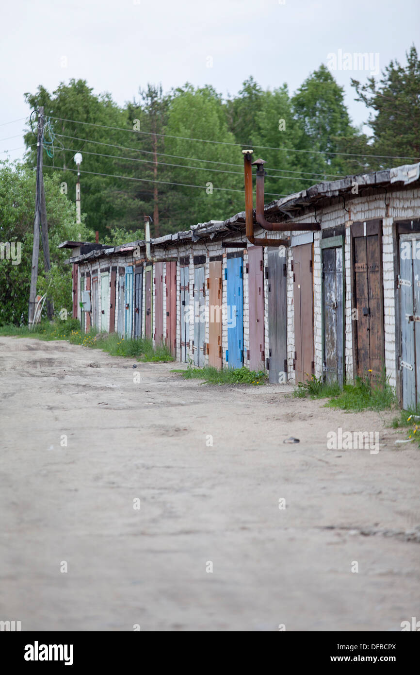 Brick garages with an iron gate in Russian province town, Russia Stock ...