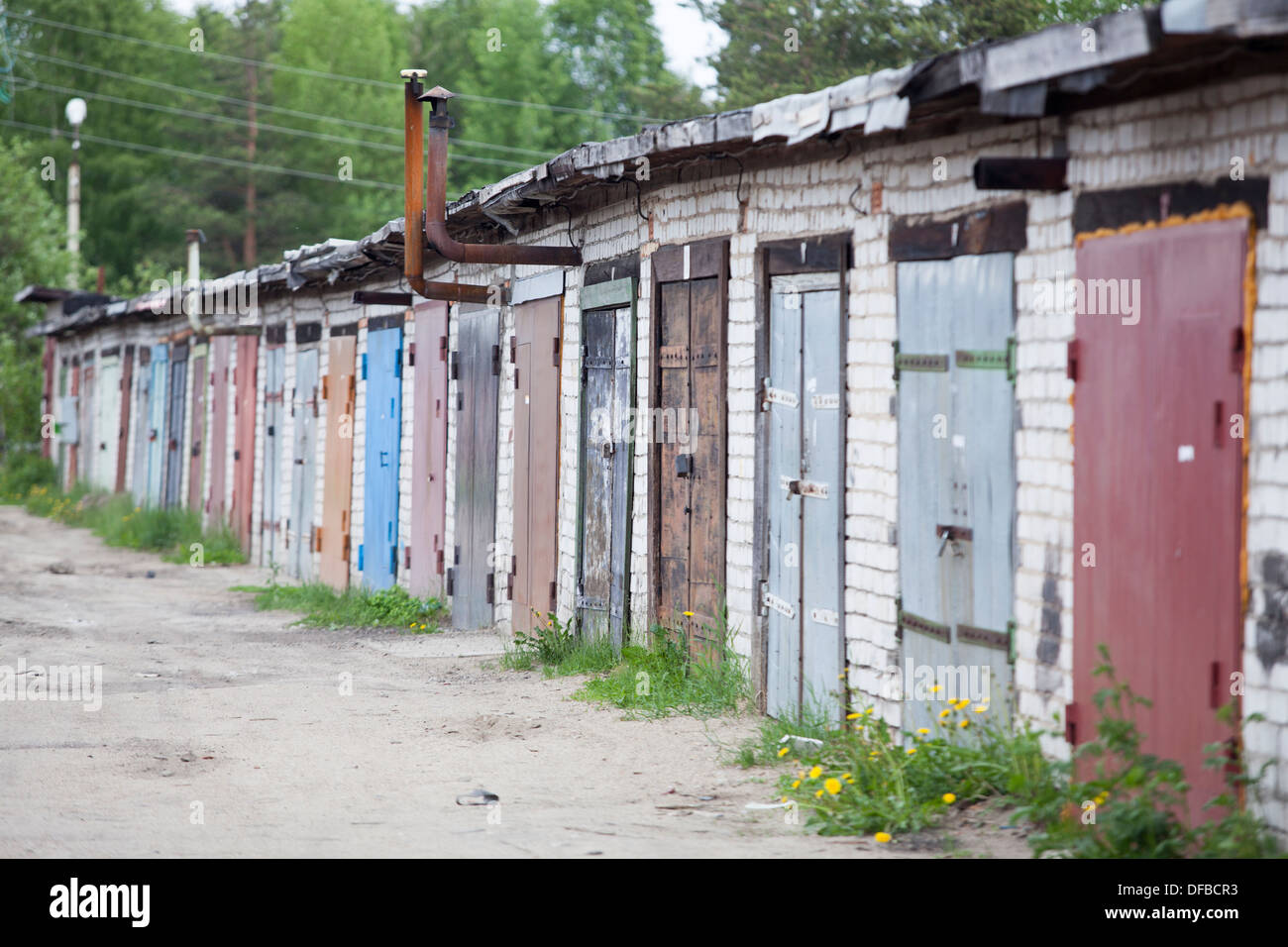 Brick garages with an iron color gates in Russian province town, Russia ...