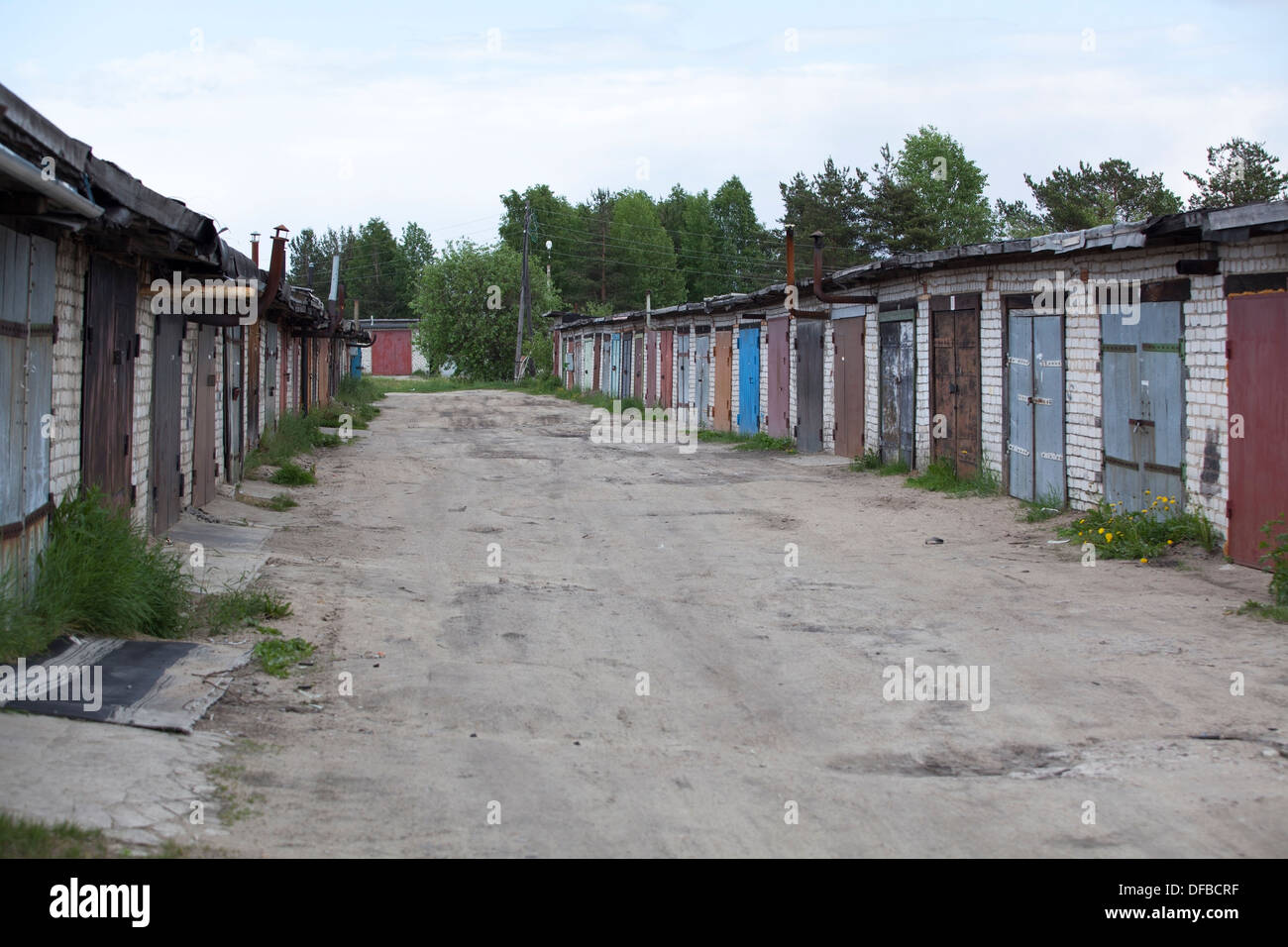 Brick closed garages with an iron gate in Russian province town, Russia ...