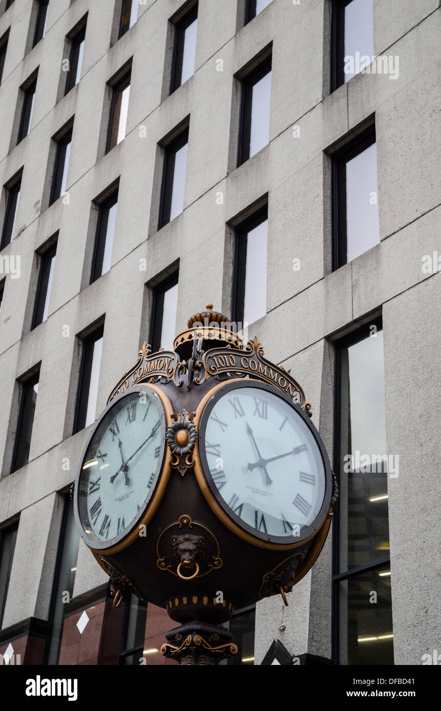 Street outside clocks near skyscraper Stock Photo - Alamy