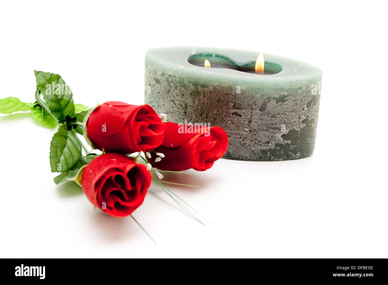 Candle with red rose Stock Photo - Alamy