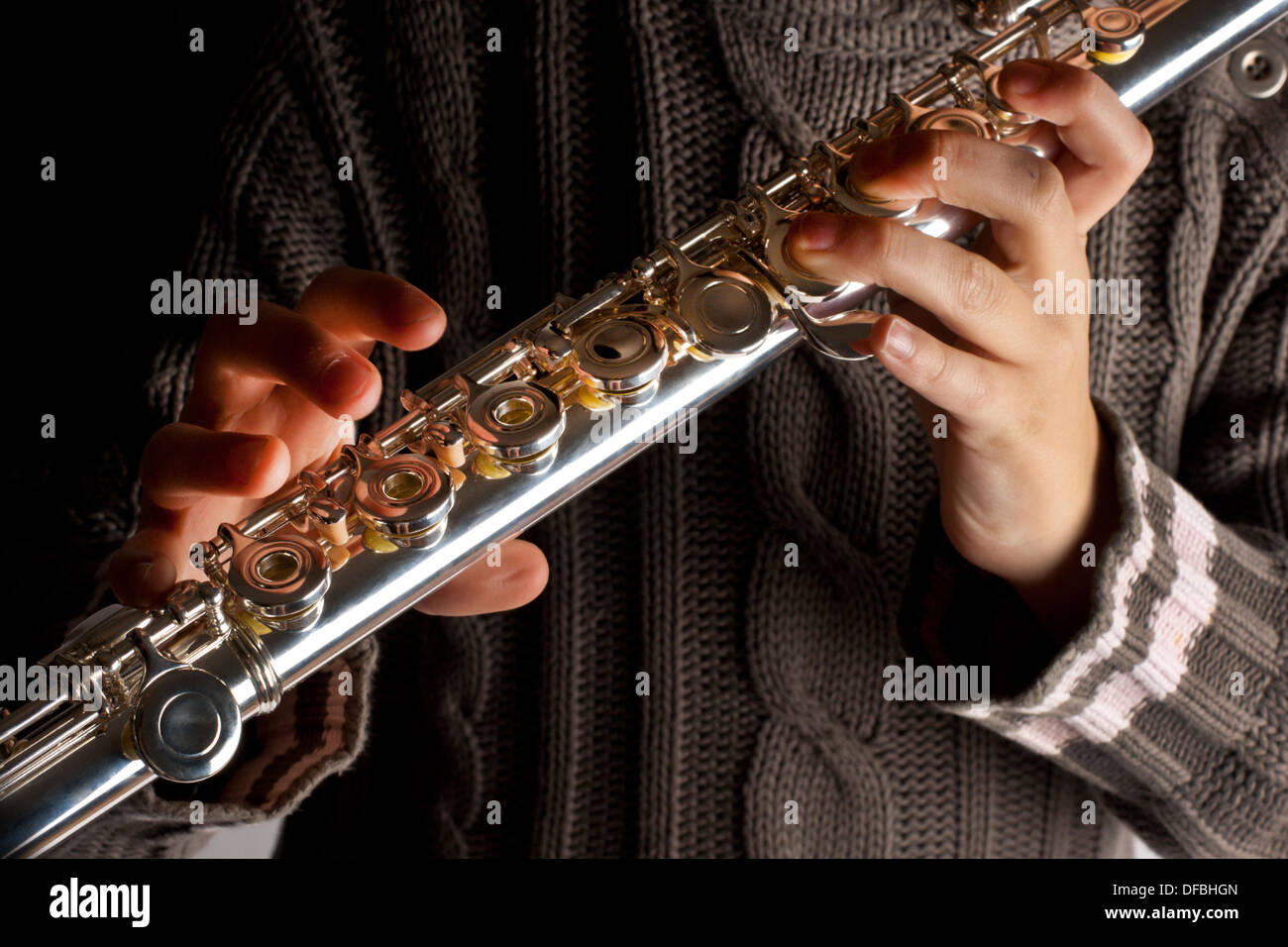 Girl playing flute Stock Photo - Alamy