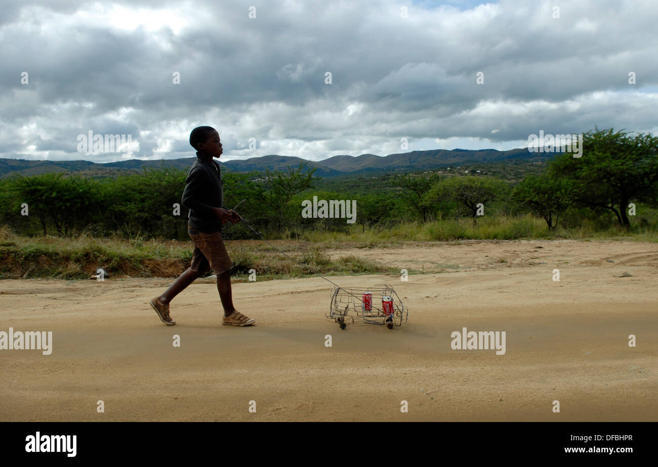 A boys play with a wire car near home South African President Jacob ...