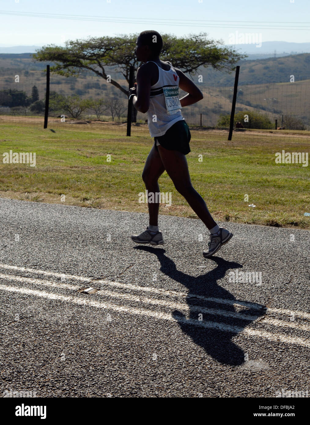 A lone runner passes through Camperdown during Comrades Marathon June ...
