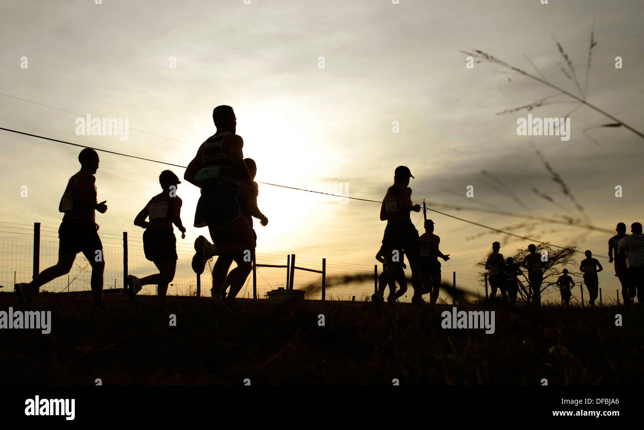 Runners pass through Camperdown dawn during Comrades Marathon May 24 ...