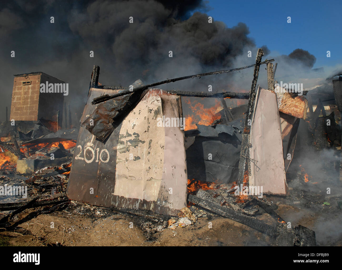 A general view destruction as a shack fire rages out control in Kennedy ...