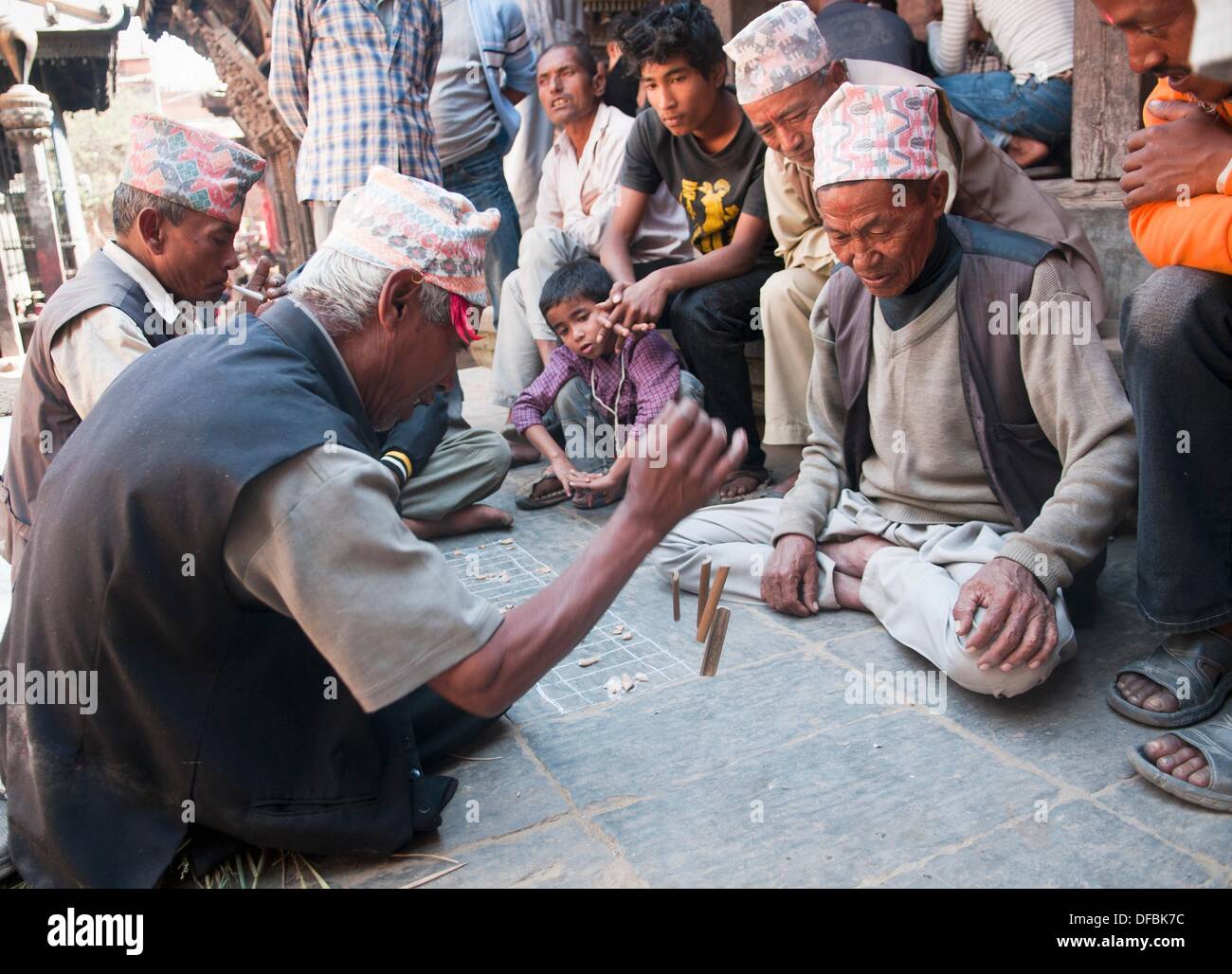 Nepali men playing games in ancient Bhaktapur, near Kathmandu, Nepal ...