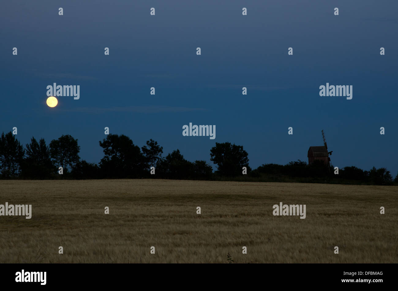Moon over windmill and a cornfield Stock Photo - Alamy
