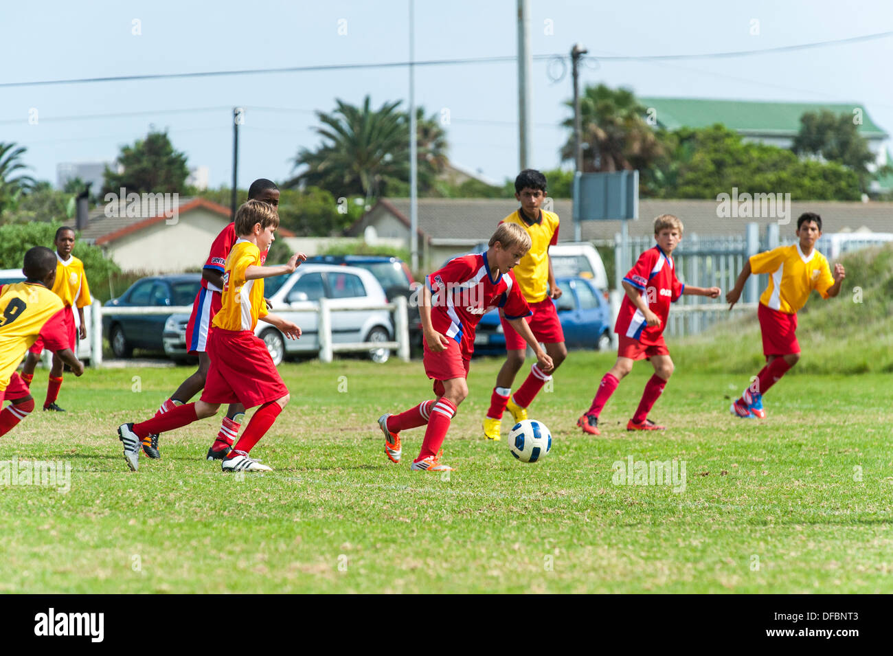 Children chasing football hi-res stock photography and images - Alamy
