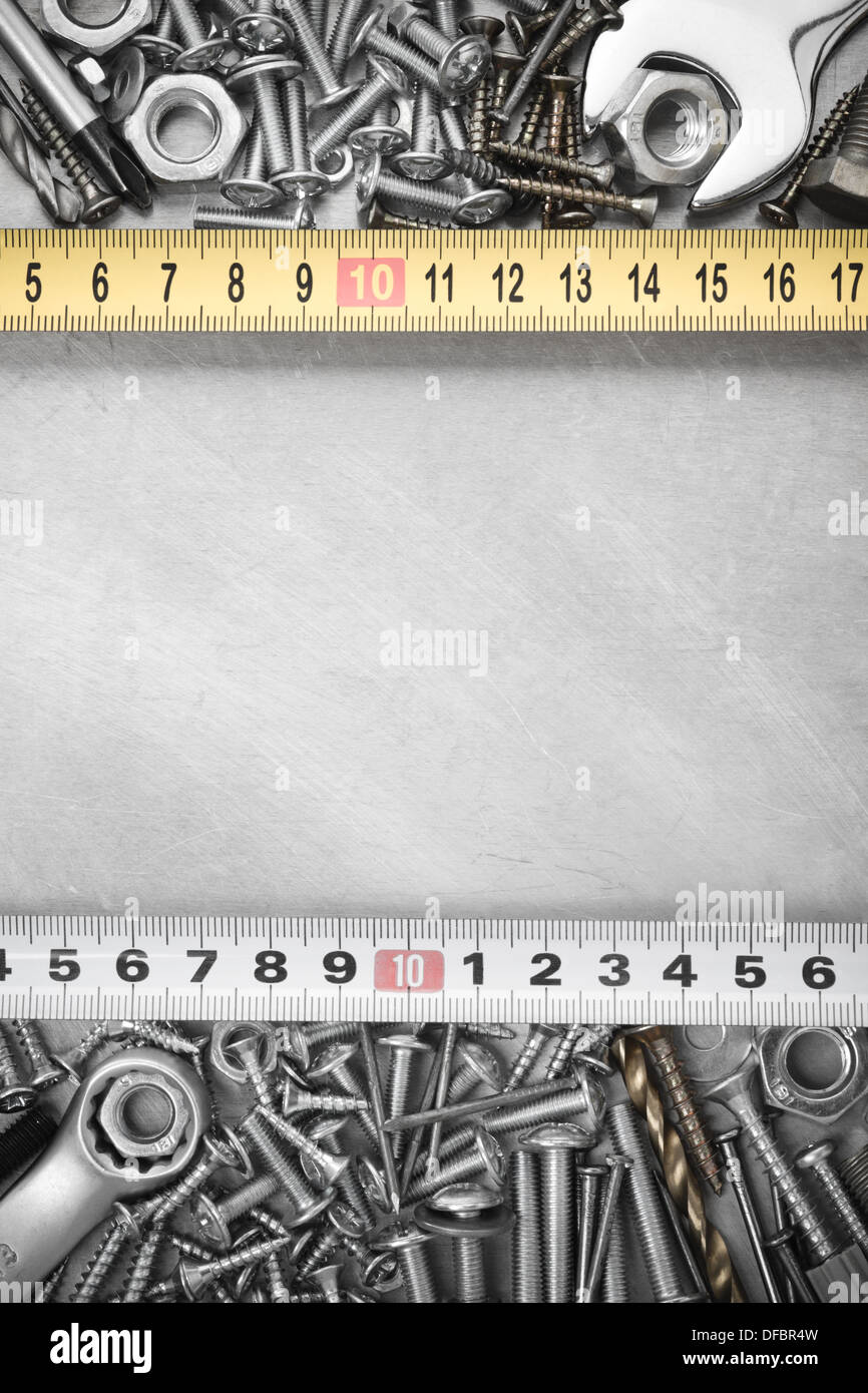 metal construction hardware tool on metal texture Stock Photo - Alamy