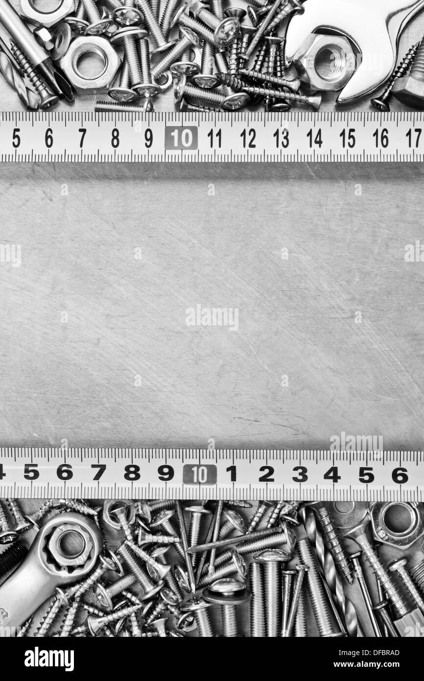 metal construction hardware tool on metal texture Stock Photo - Alamy