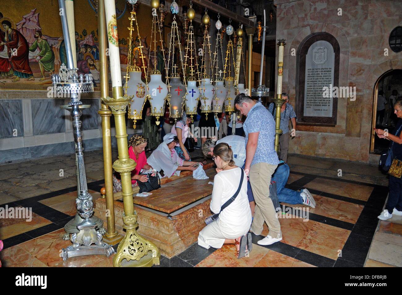 View of the Stone of Anointing at the entrance of the Church of the ...