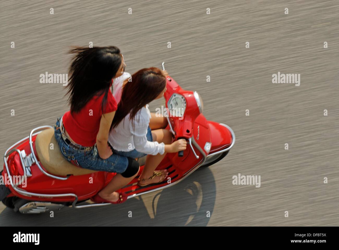 Girl moped red hi-res stock photography and images - Alamy