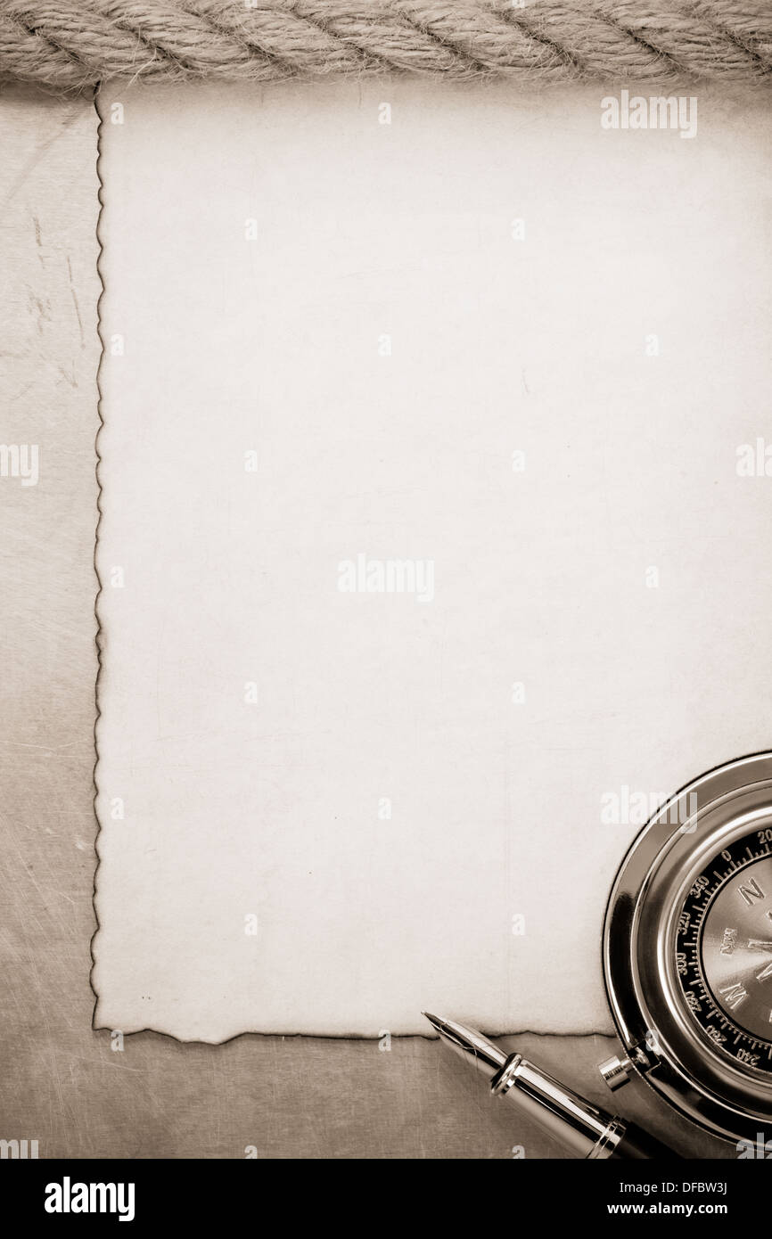 parchment and compass with ship rope Stock Photo - Alamy