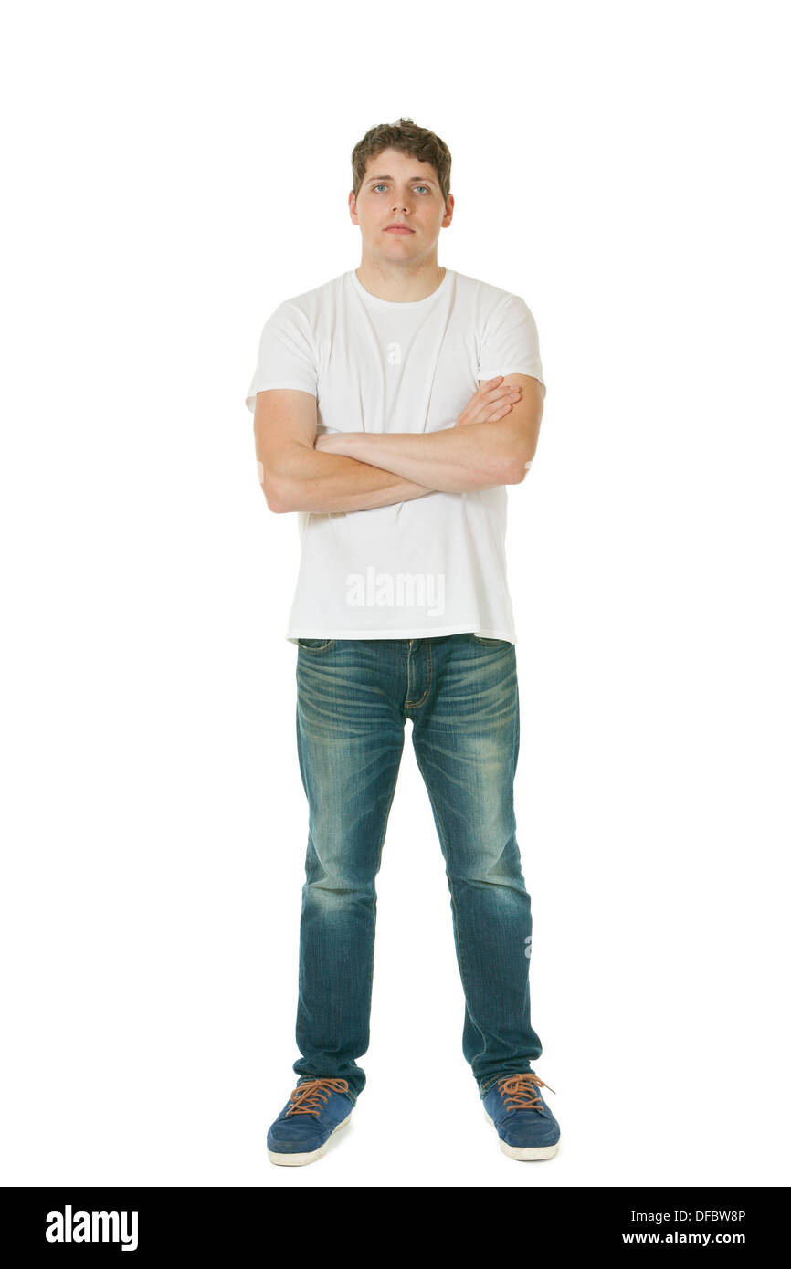 Young man standing with arms crossed Stock Photo - Alamy