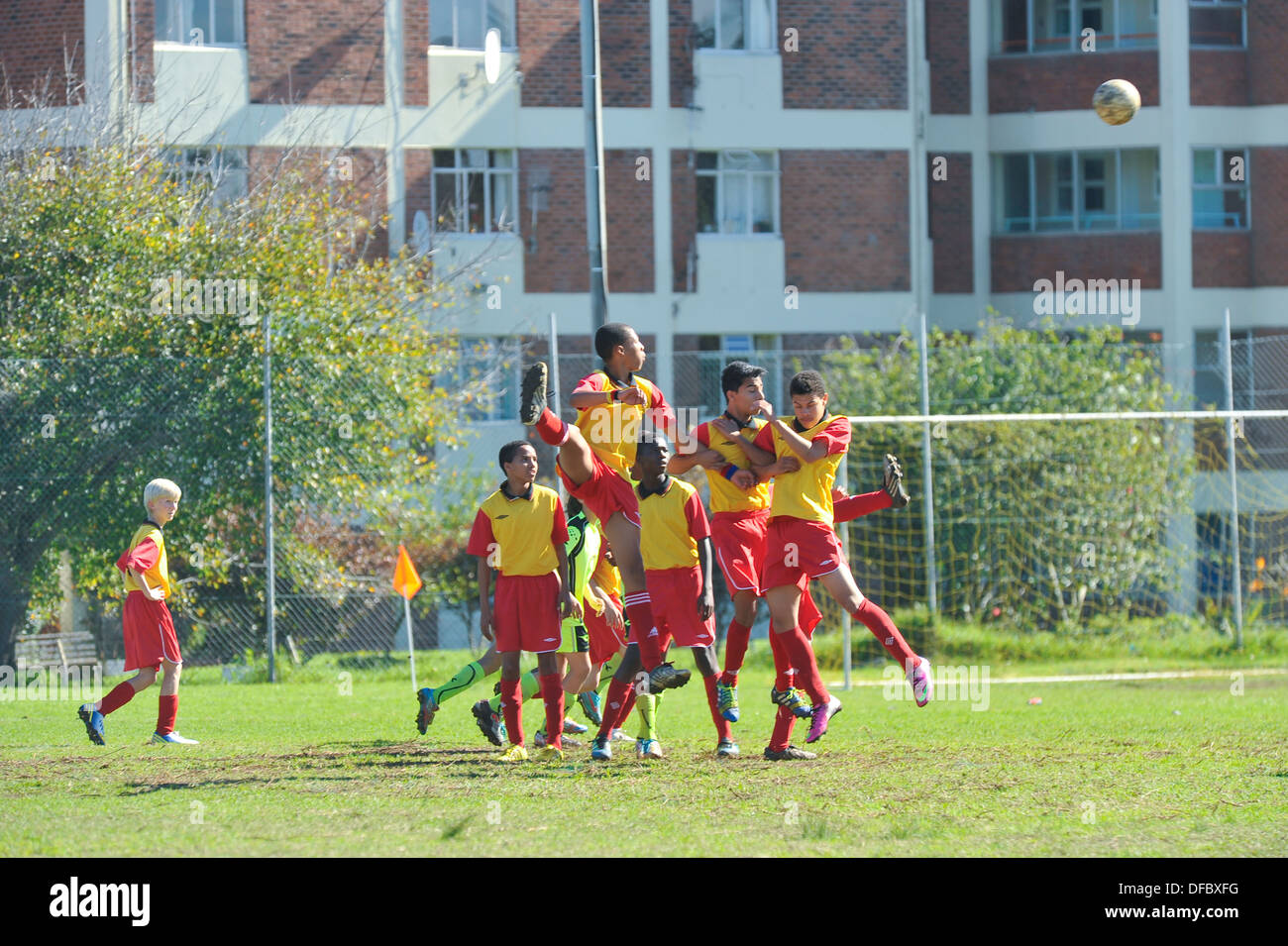 Junior football players jumping to head the ball, Cape Town, Western ...