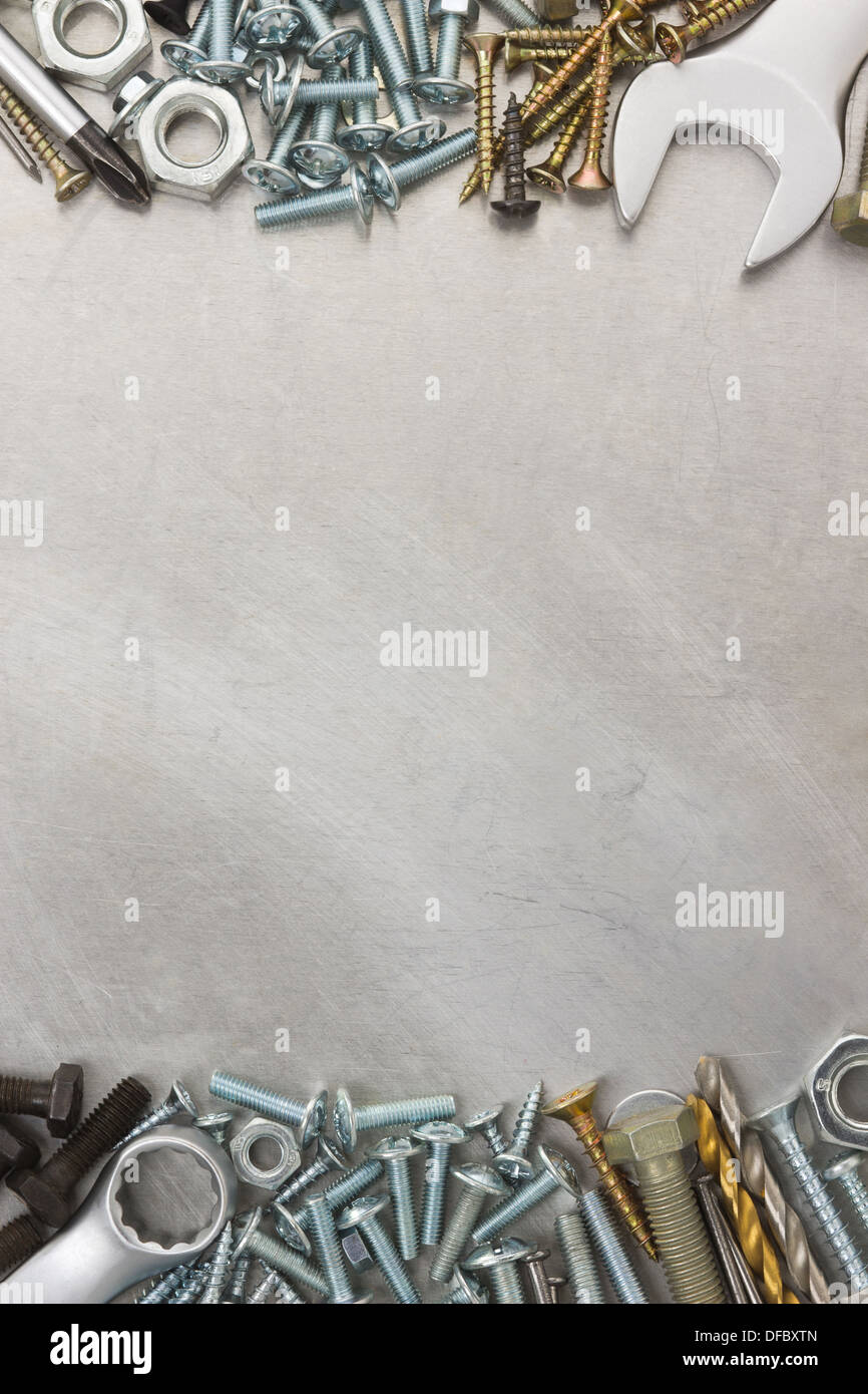 metal construction hardware tool on metal texture Stock Photo - Alamy