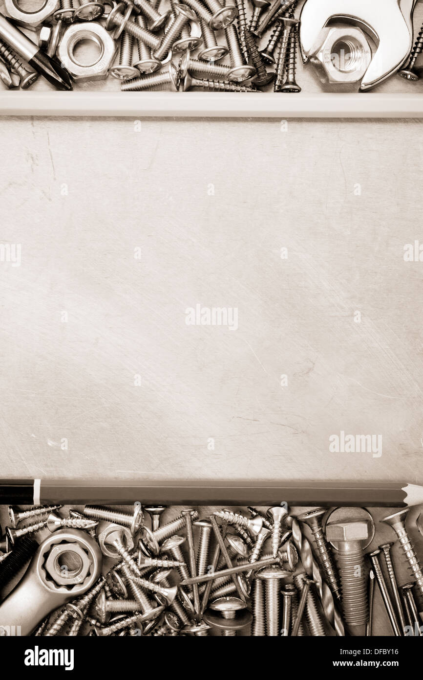 metal construction hardware tool on metal texture Stock Photo - Alamy