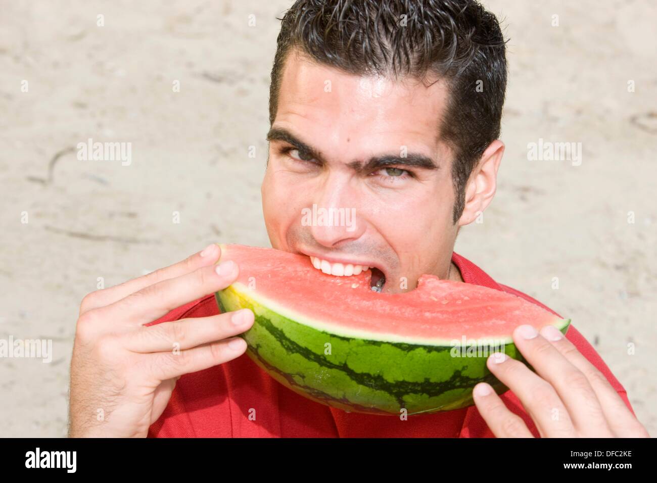 Melon head man holding melon hi-res stock photography and images - Alamy