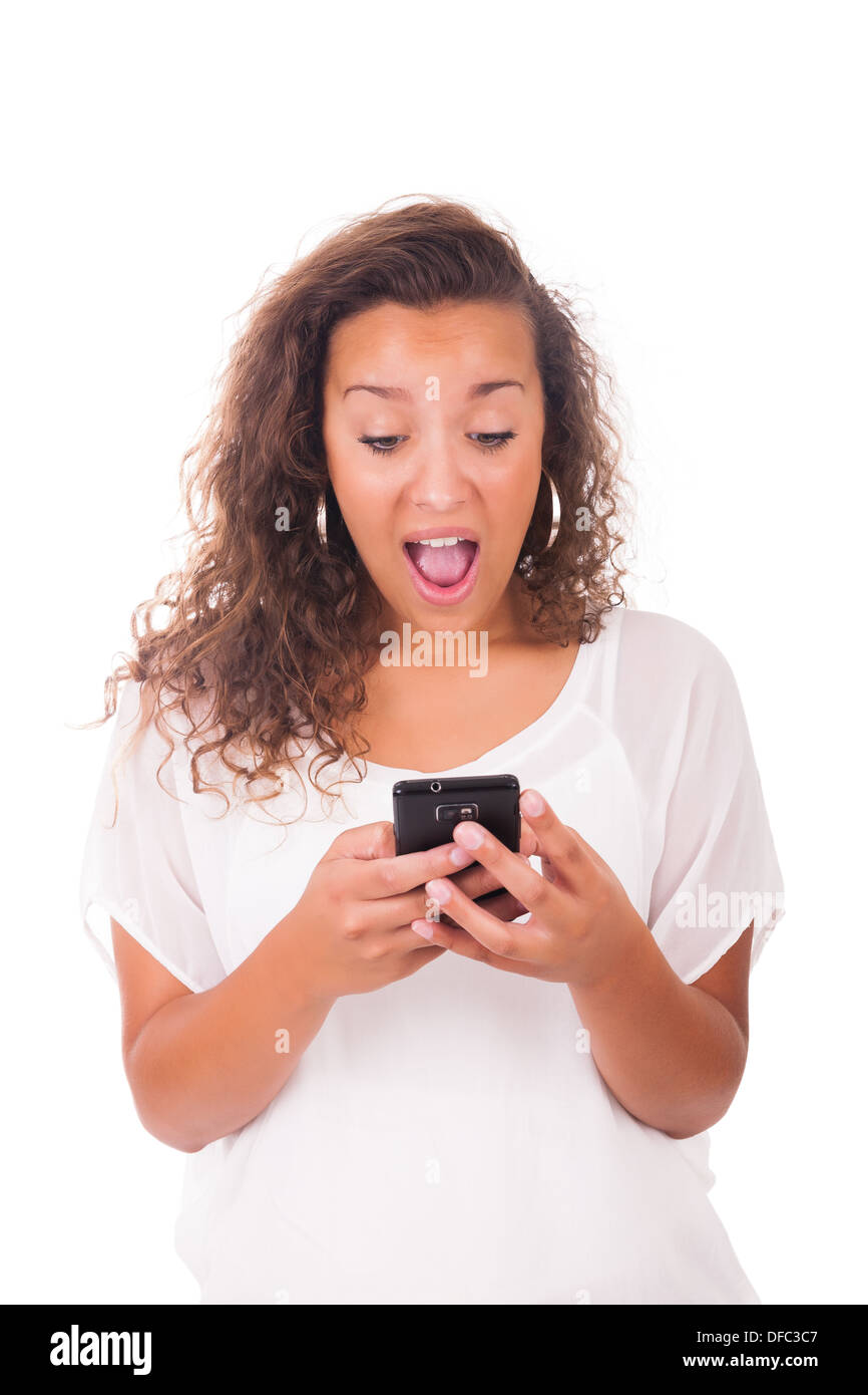 Happy woman texting on her phone isolated over white background Stock ...