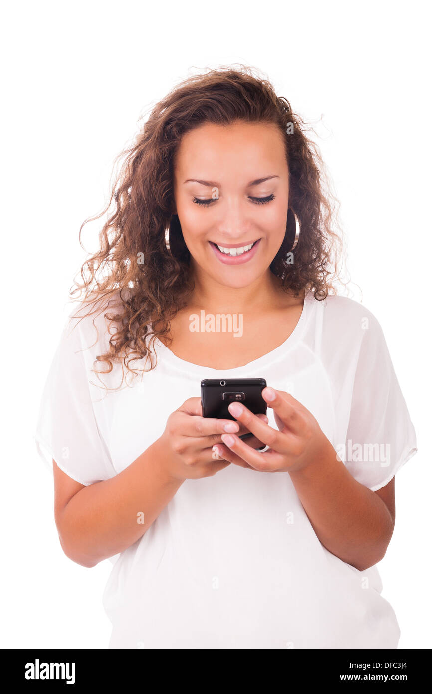 Happy woman texting on her phone isolated over white background Stock ...