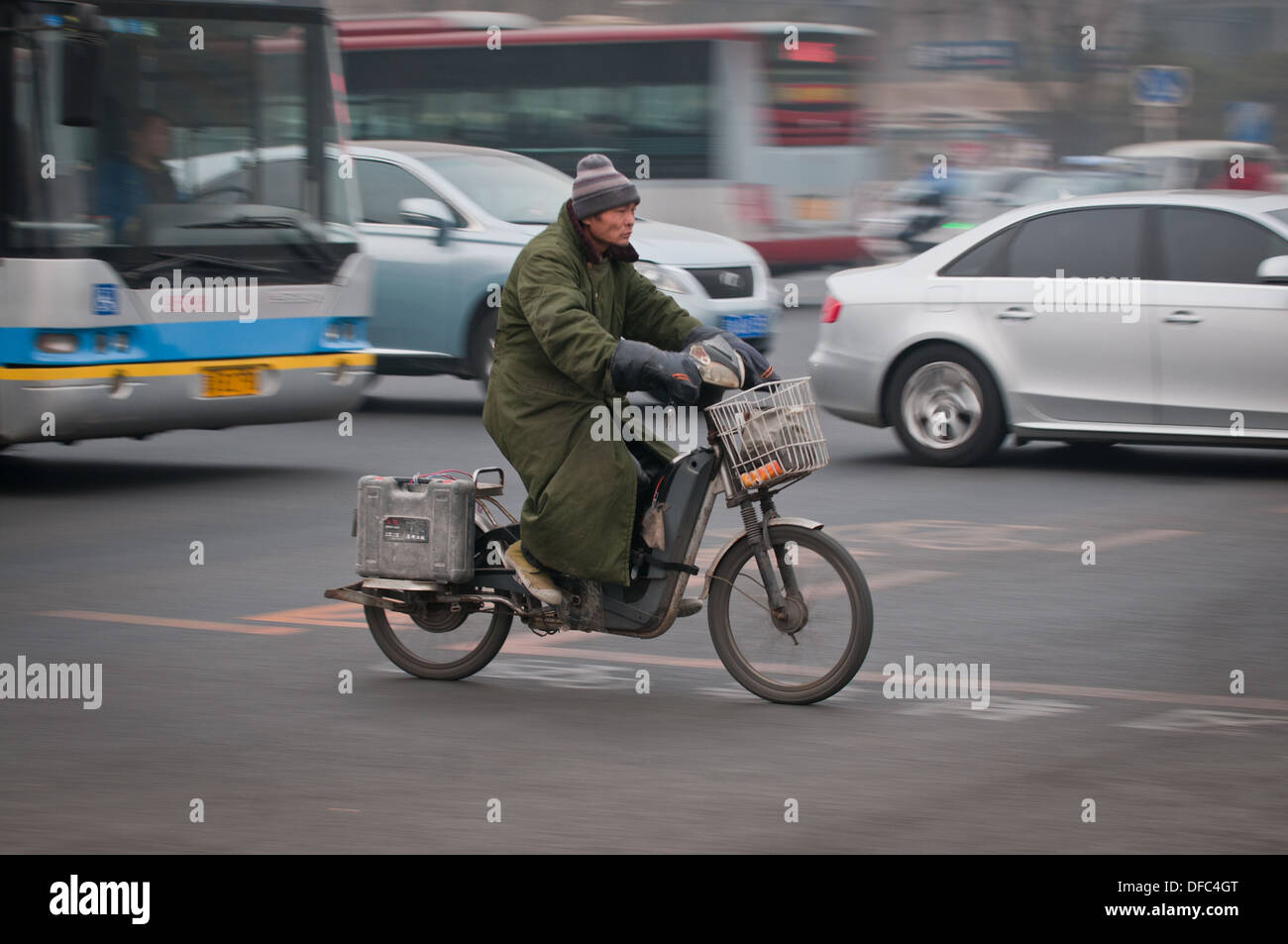 Man on moped in Beijing, China Stock Photo - Alamy