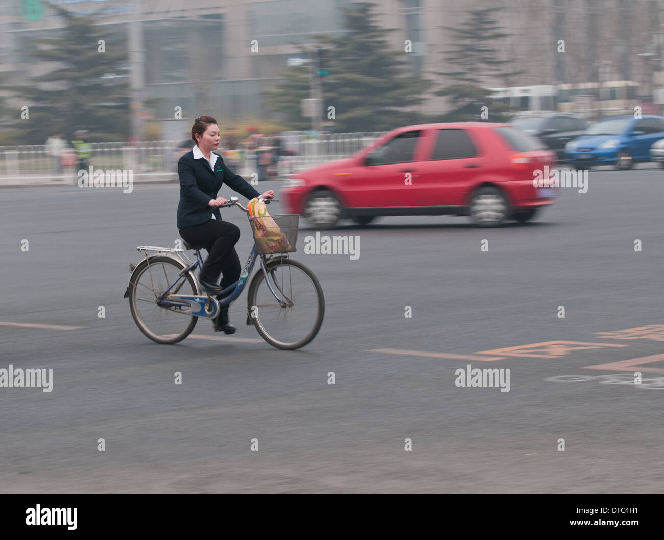 Chinese girl riding bicycle in hi-res stock photography and images - Alamy