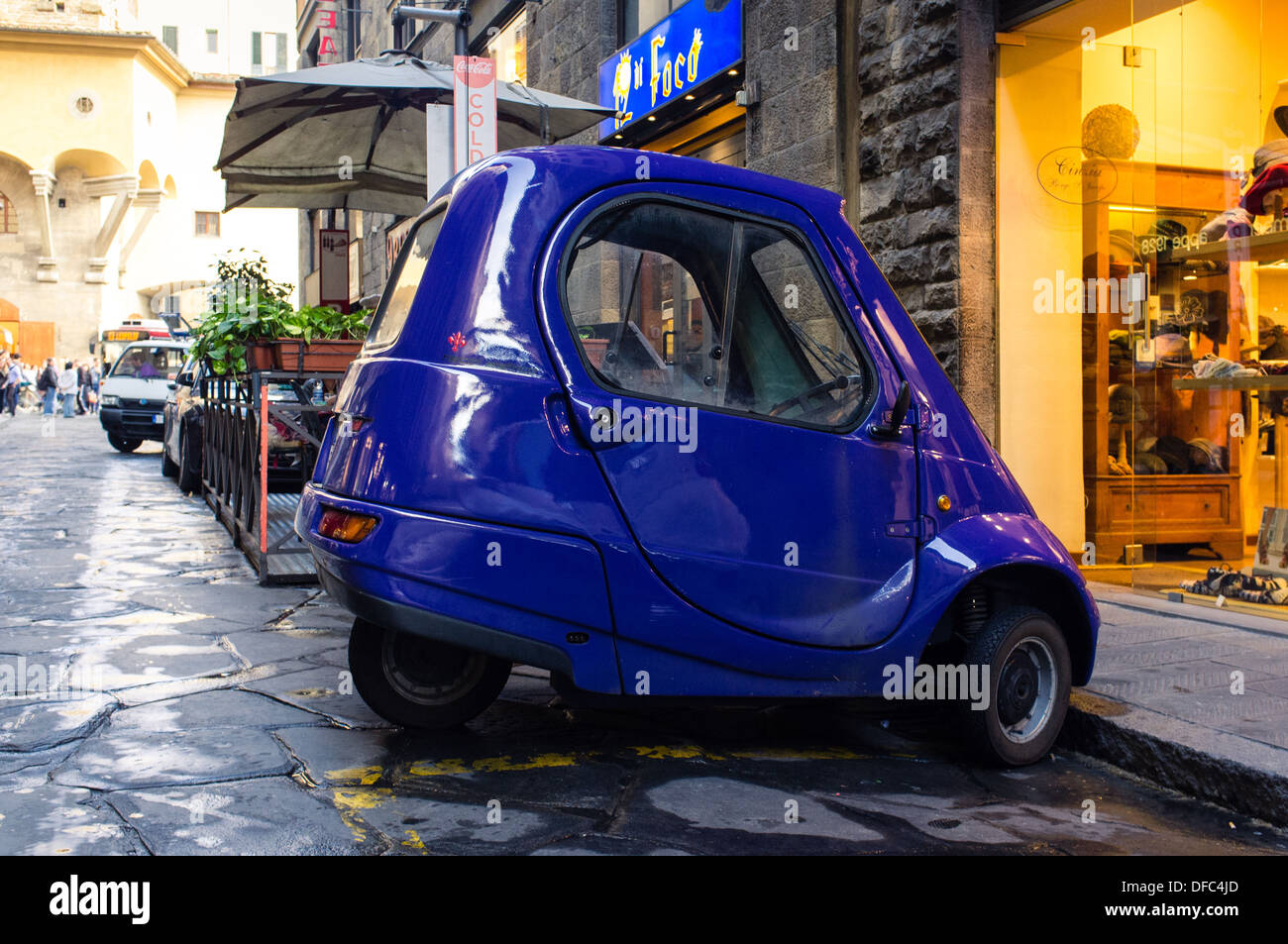 Small old Italian car parked in a side street in Florence, Italy Stock ...