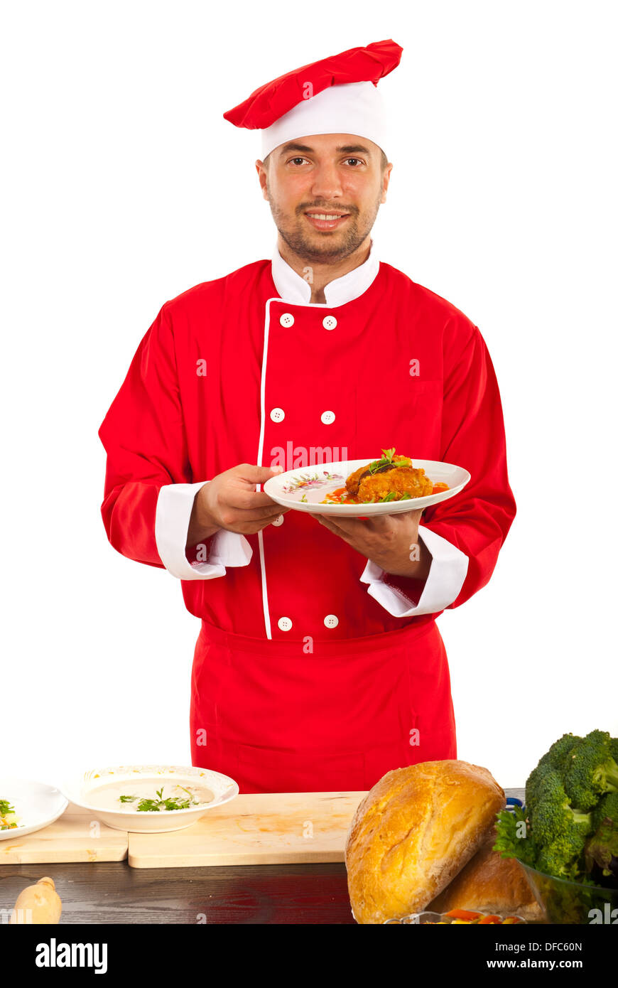 Happy chef showing food on plate isolated on white background Stock ...