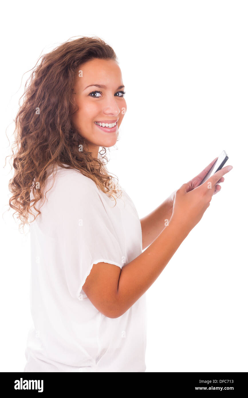 Happy woman texting on her phone isolated over white background Stock ...