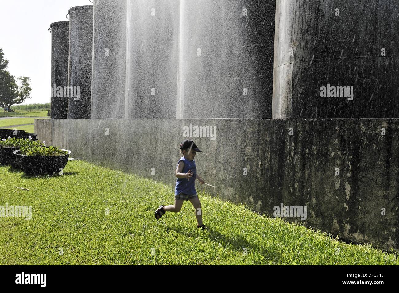 little boy running under steam spraying the fermentation tanks, Rum ...