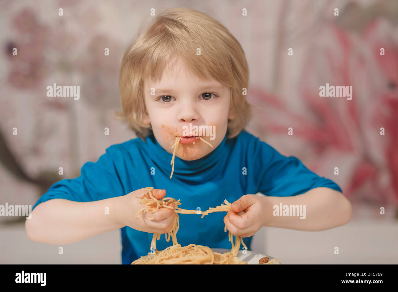 Portrait messy boy eating spaghetti hi-res stock photography and images ...