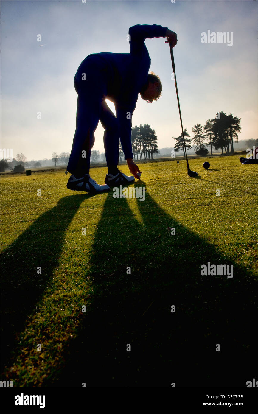 Golfer playing golf in the sun Stock Photo - Alamy
