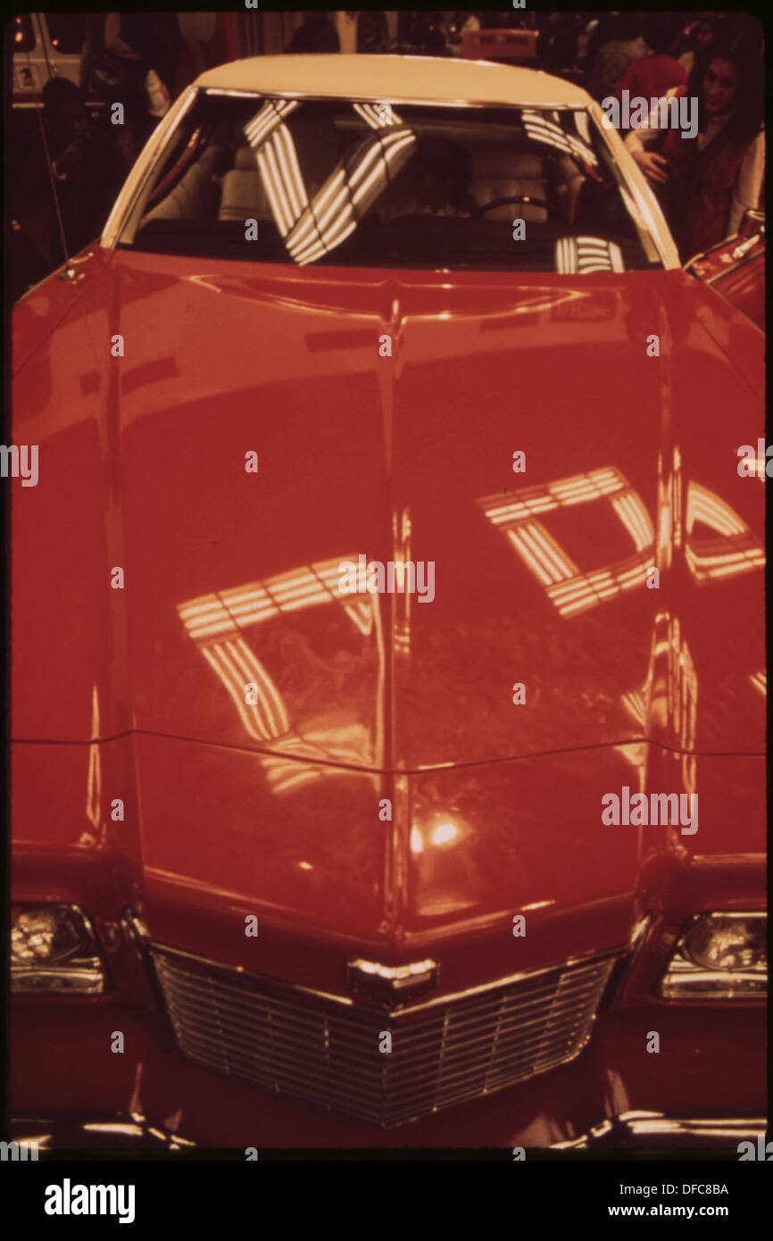 The image depicts an automobile show held at the New York Coliseum ...