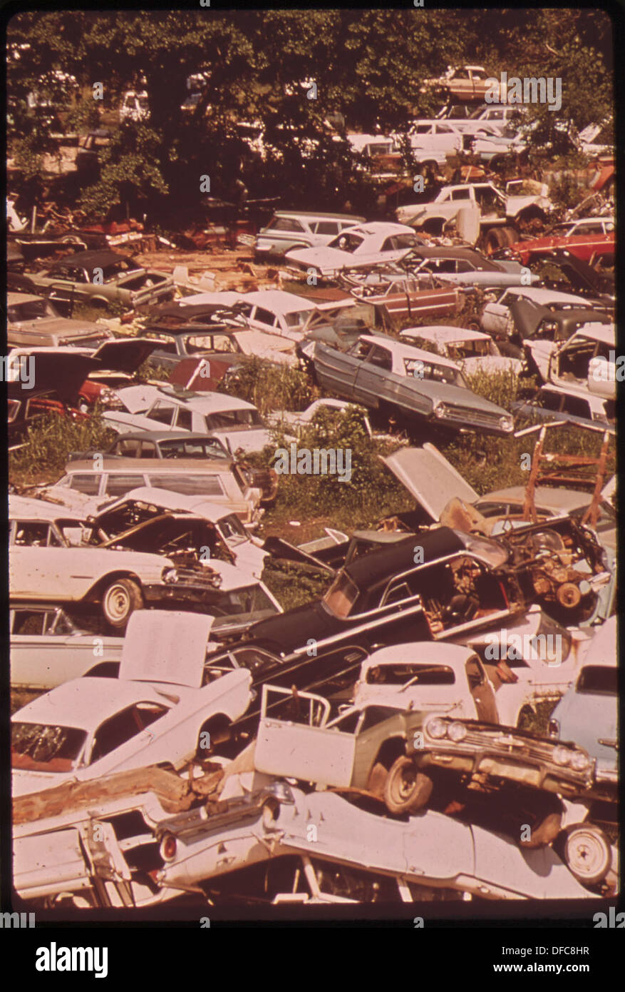 This image shows an auto dump, a facility where vehicles are dismantled ...