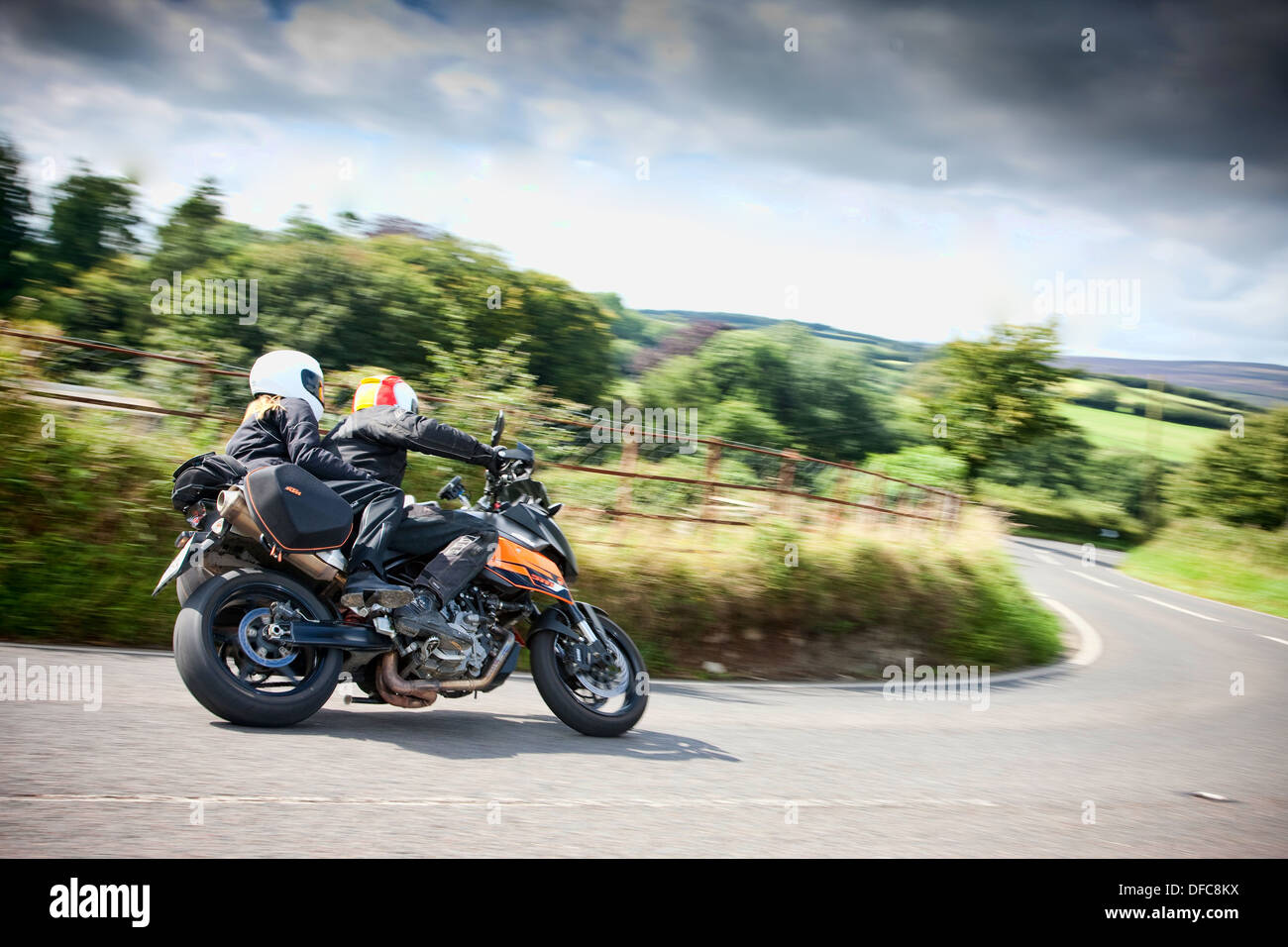 Biker couple on a KTM touring through England Stock Photo - Alamy