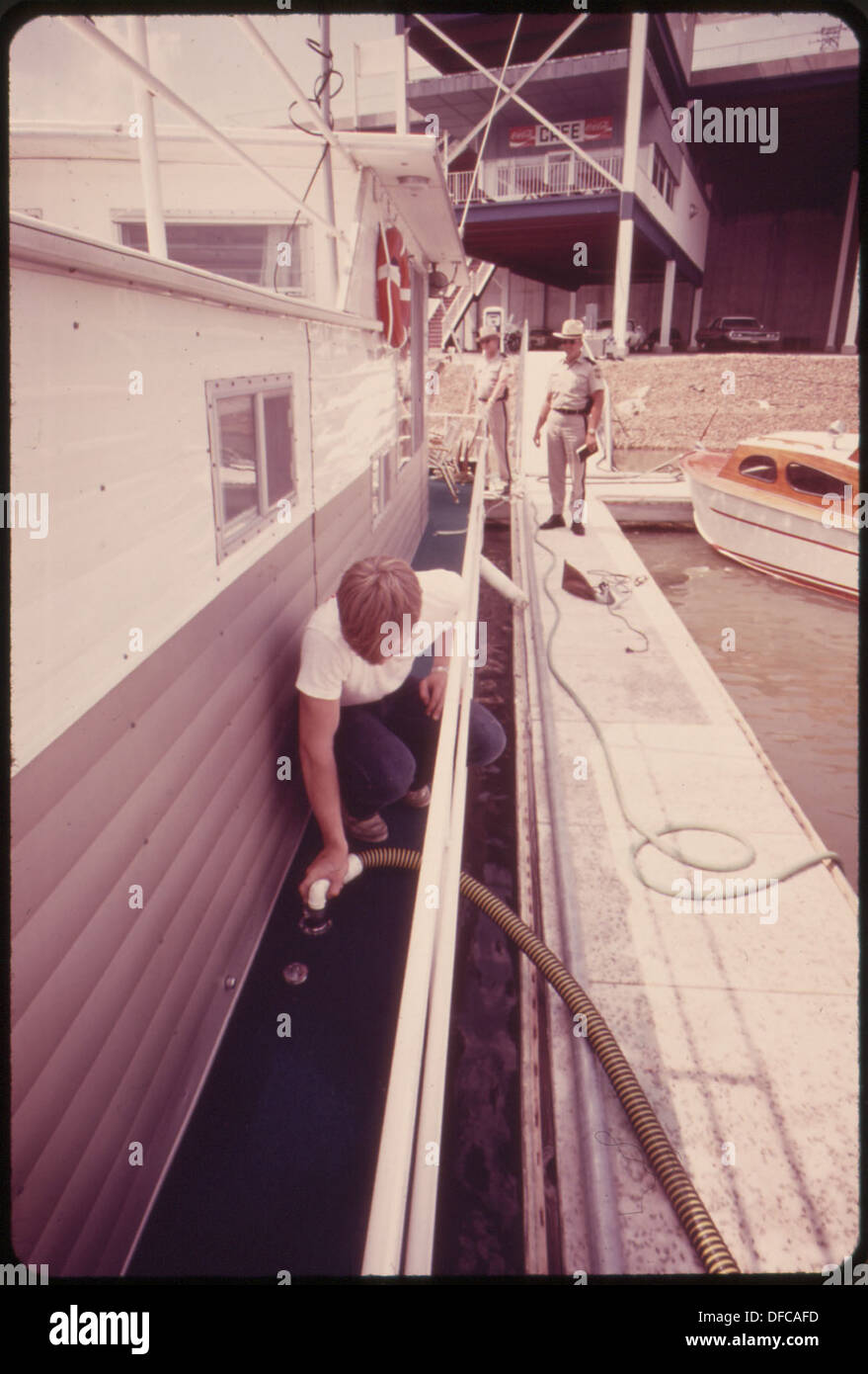 A member of the Missouri Water Patrol oversees the process of pumping ...